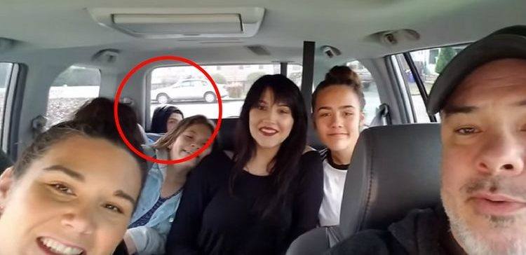 Sneaky Figure Photobombs Family in Car Pic